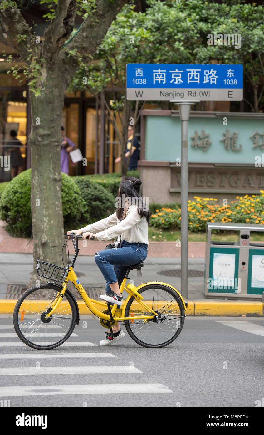 Chinese girl on bicycle hi-res stock photography and images - Alamy