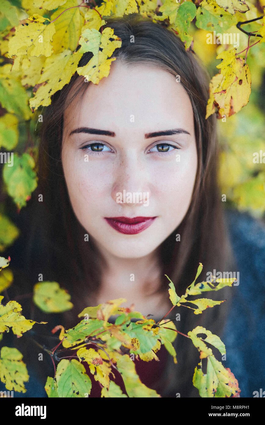 High angle portrait of woman by trees at park Stock Photo - Alamy