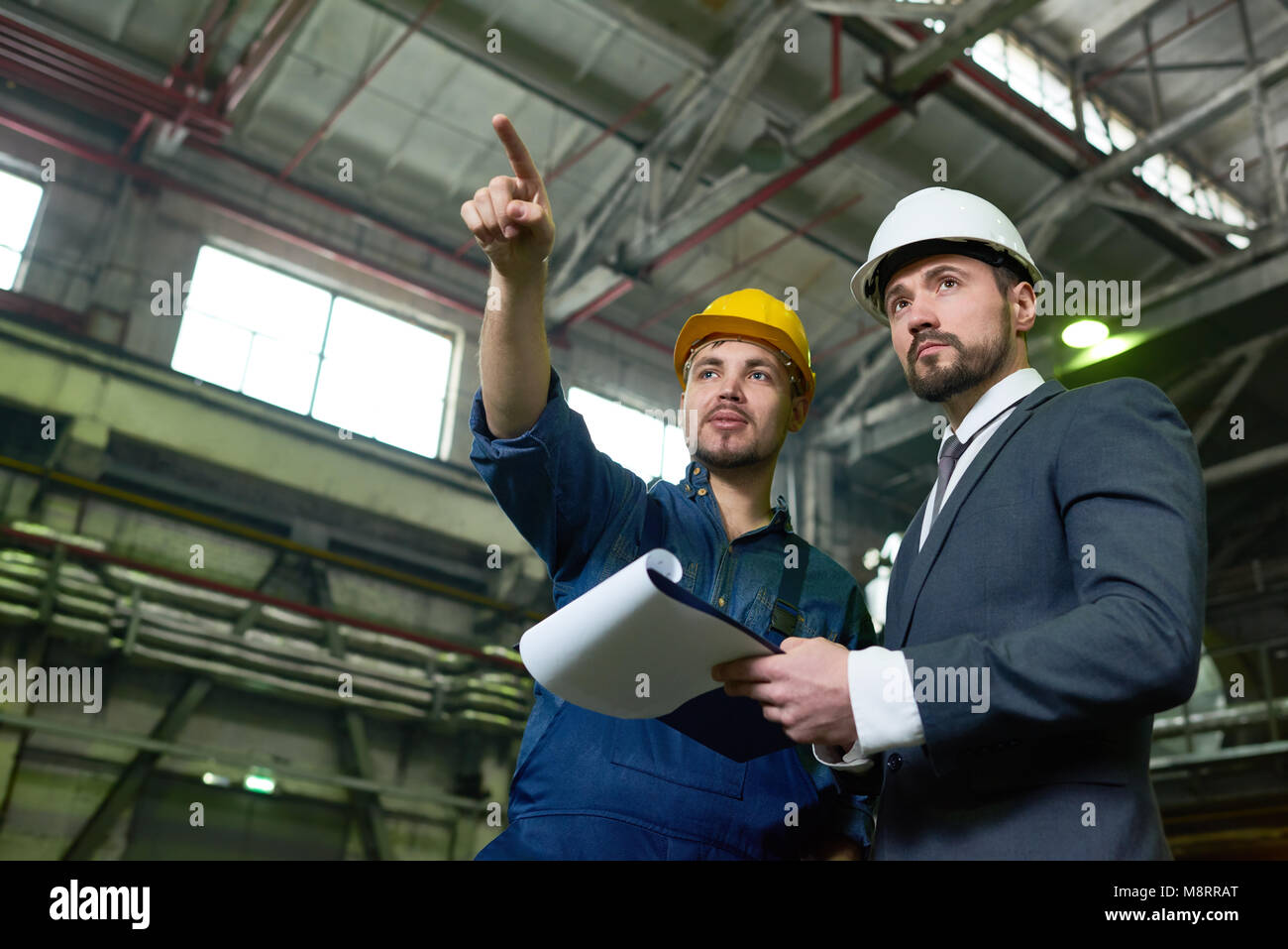 Engineers Discussing Work Stock Photo - Alamy