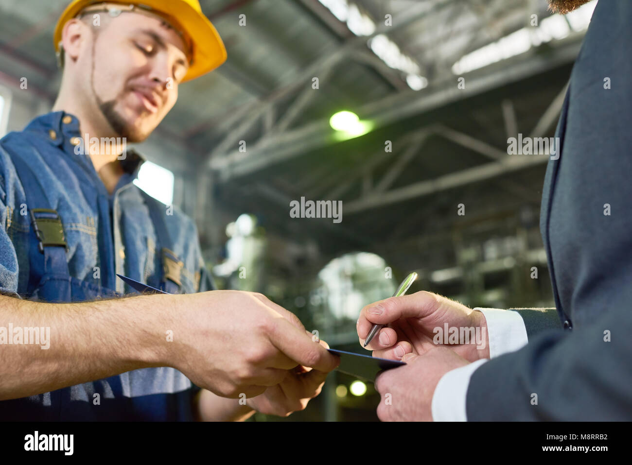 Investment Deal at Factory Stock Photo - Alamy