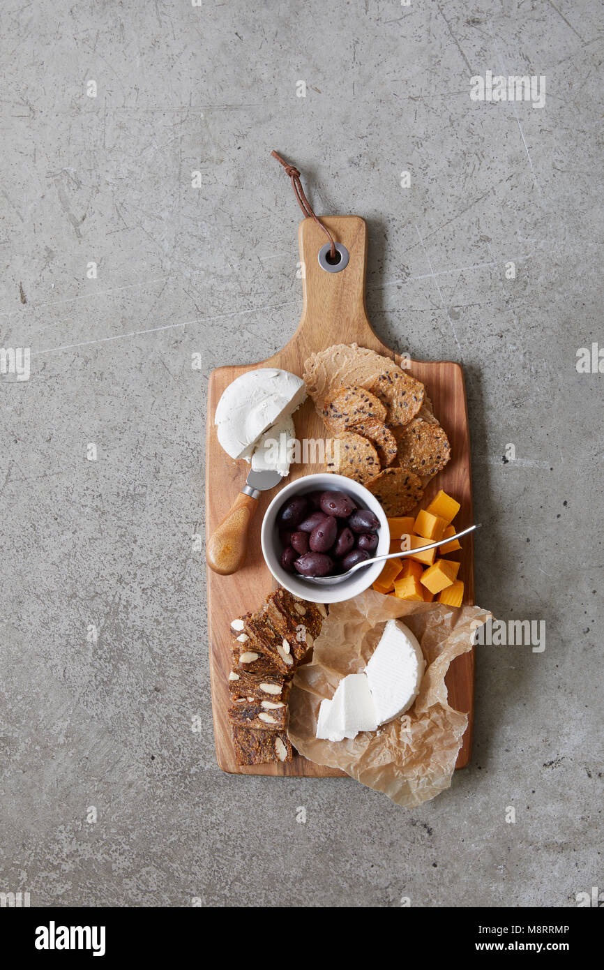 Overhead view of various food on cutting board Stock Photo - Alamy