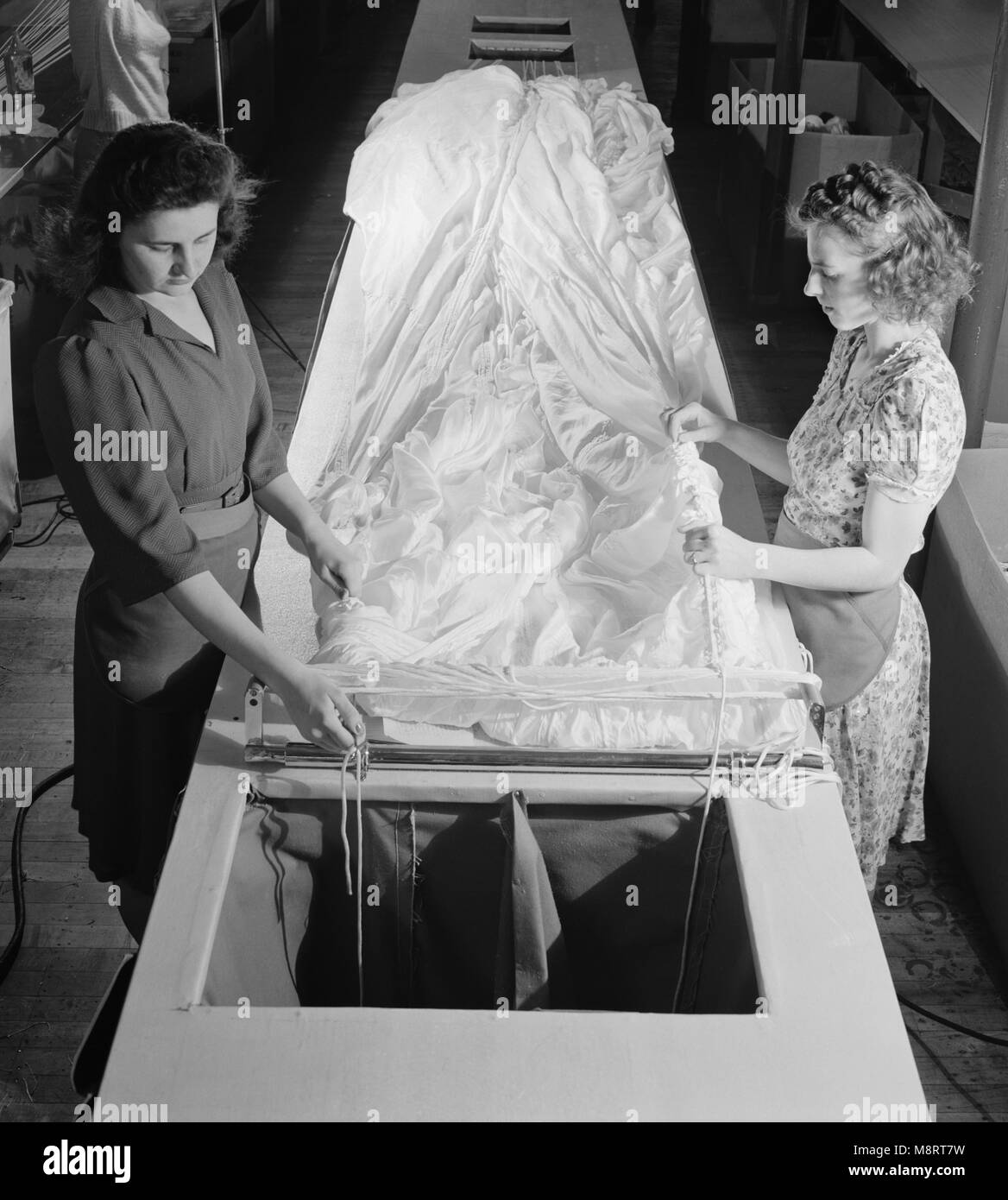 Two Female Workers Threading Shroud Cords through Parachute Fabric ...