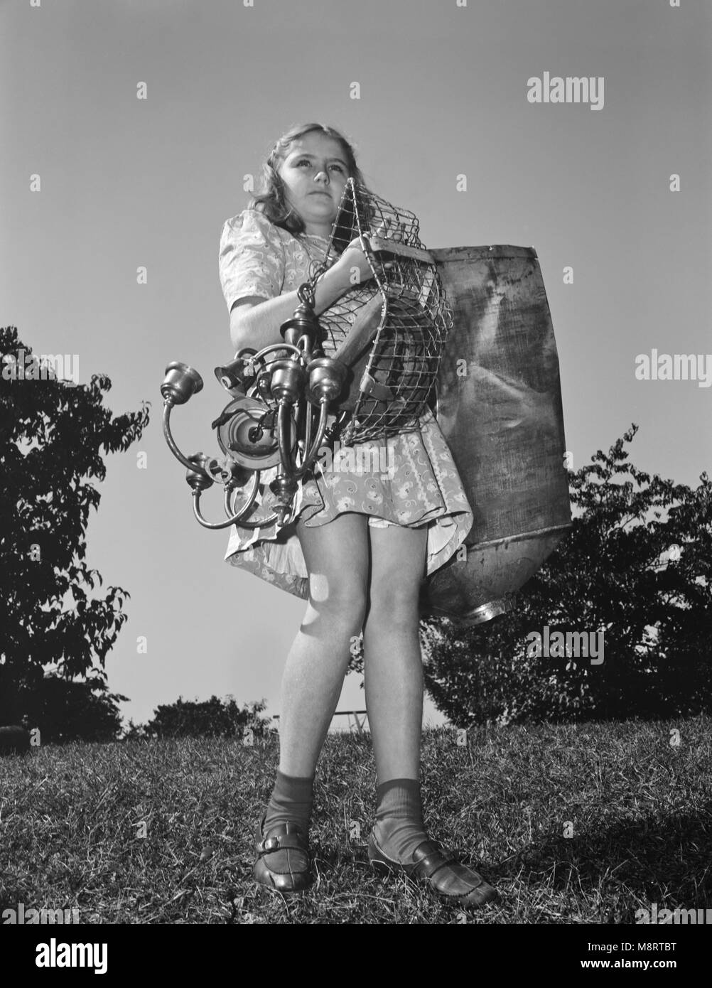 Young Girl Carrying Scrap Metal that she Collected during Scrap Salvage ...