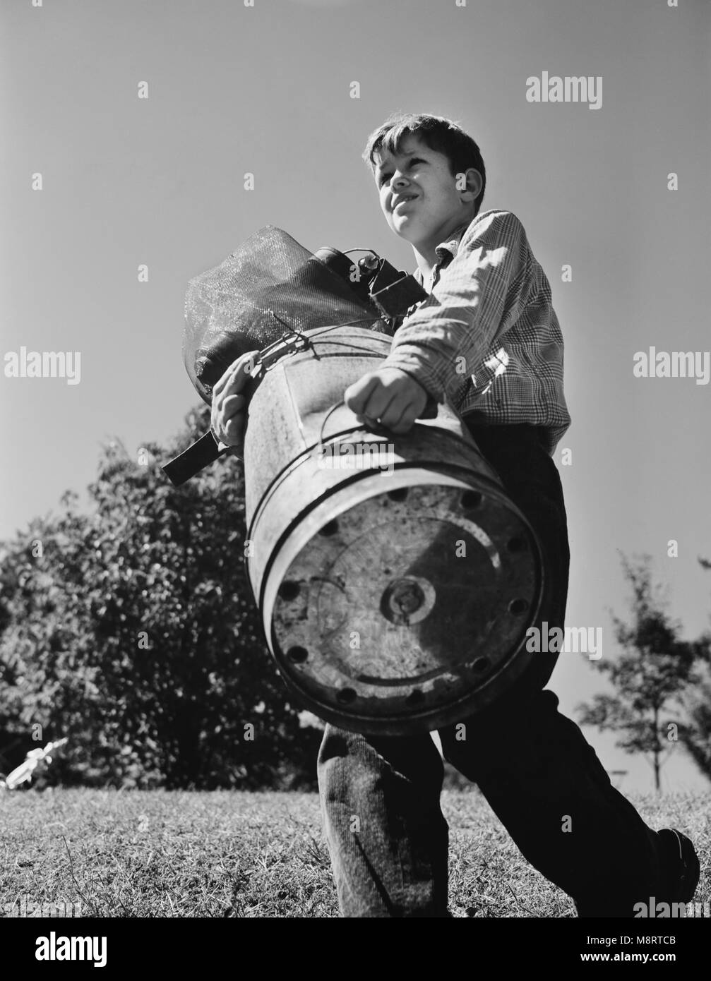 Young Boy Carrying Scrap Metal that he Collected during Scrap Salvage ...