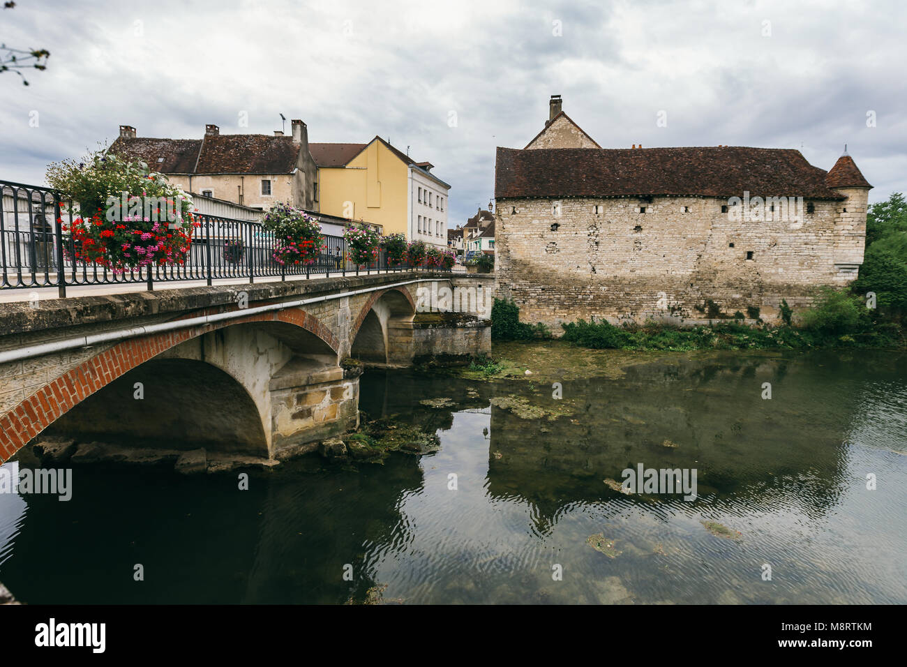 landscape of a medieval French town, over a lake stone bridge with ...