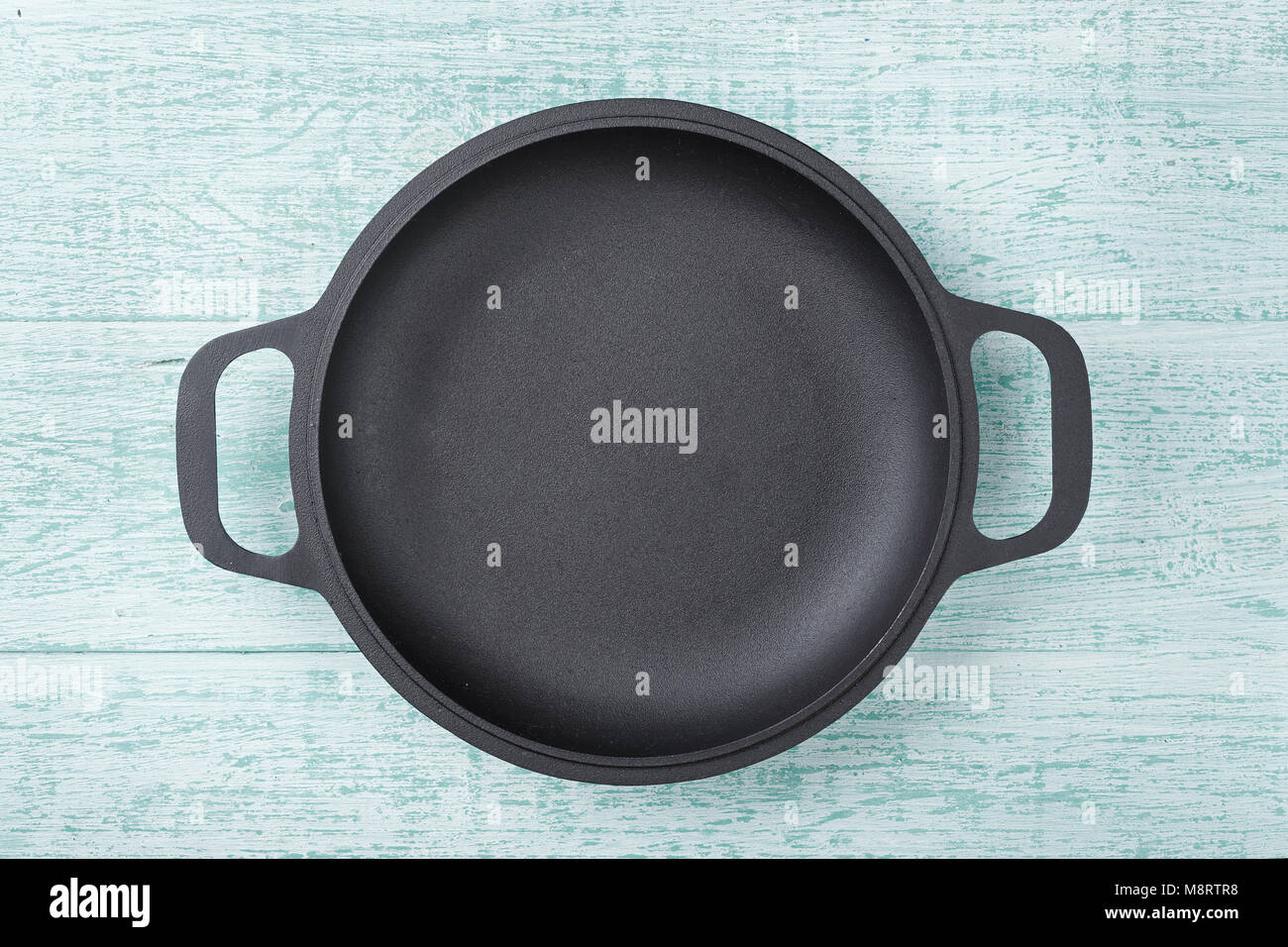 A small cast-iron frying pan for cooking for one person, a frying pan ...