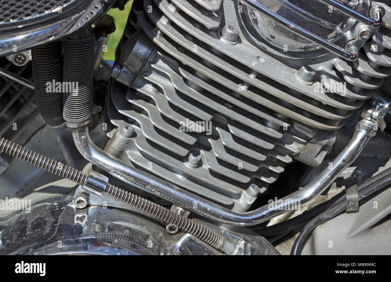 Finning cylinder motorcycle engine on closer examination Stock Photo ...