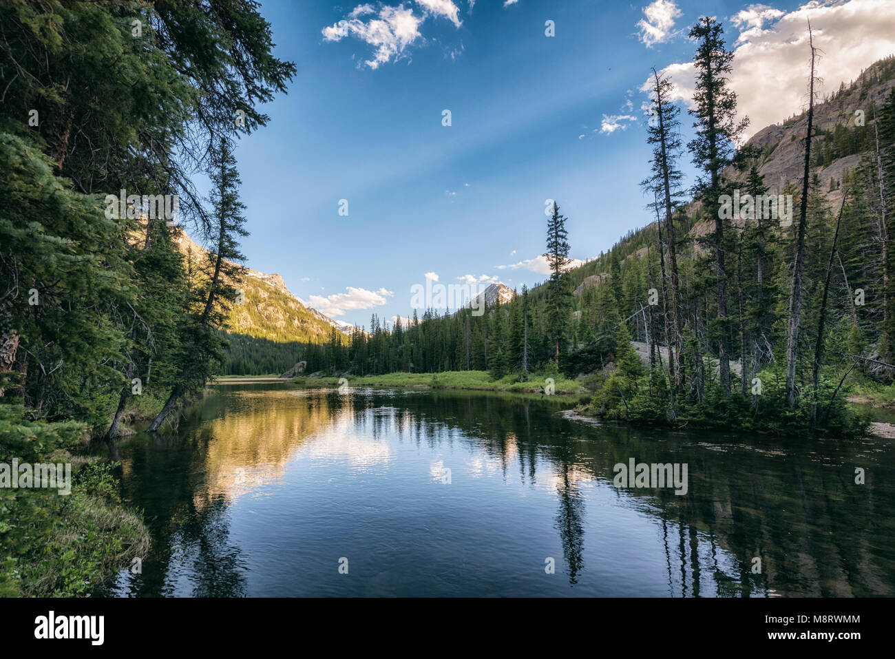 Scenic view of lake at Holy Cross Wilderness against sky Stock Photo ...