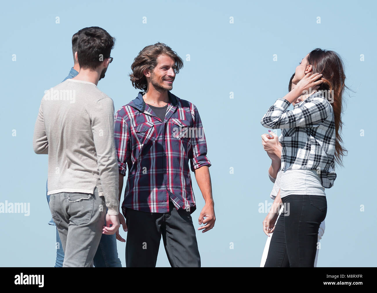 group of students talking while standing outdoors Stock Photo - Alamy