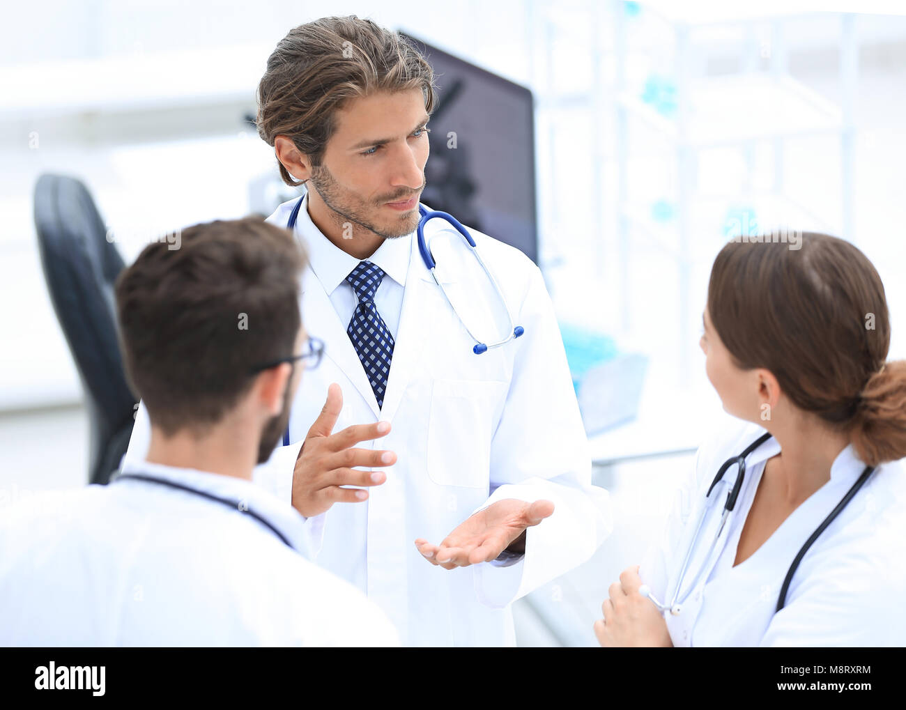 Group of doctors talking Stock Photo - Alamy