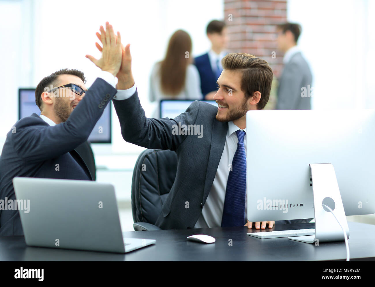 Successfull business people giving High Five for motivation Stock Photo ...