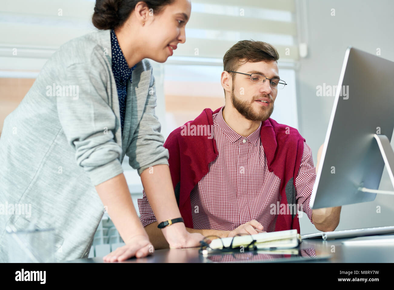 Colleagues working on project Stock Photo - Alamy