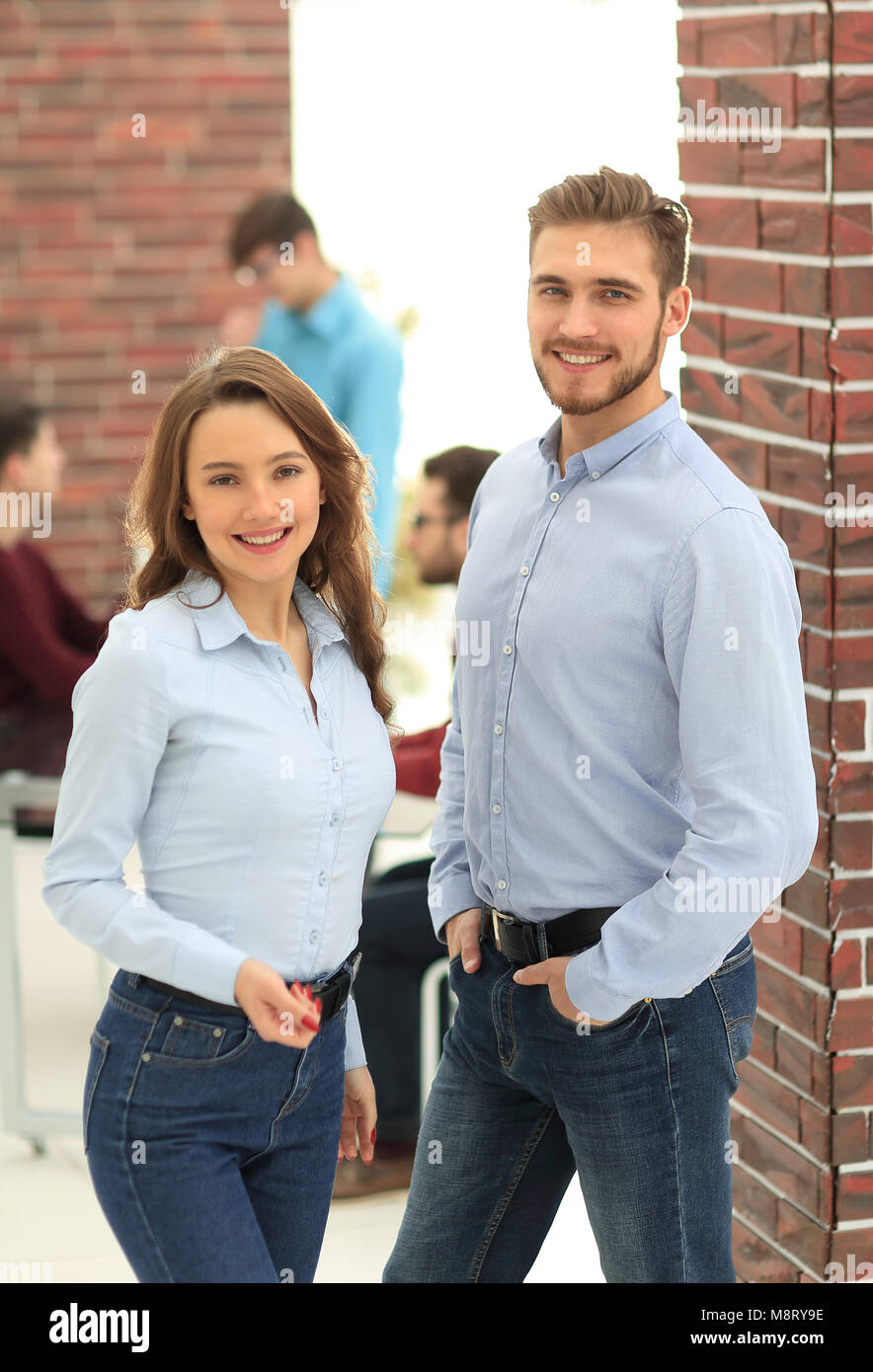 Portrait of smiling designers standing in office Stock Photo - Alamy