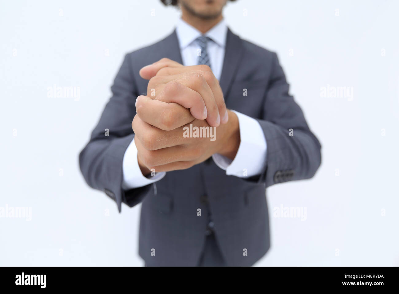 Close up on male clenched hands Stock Photo - Alamy