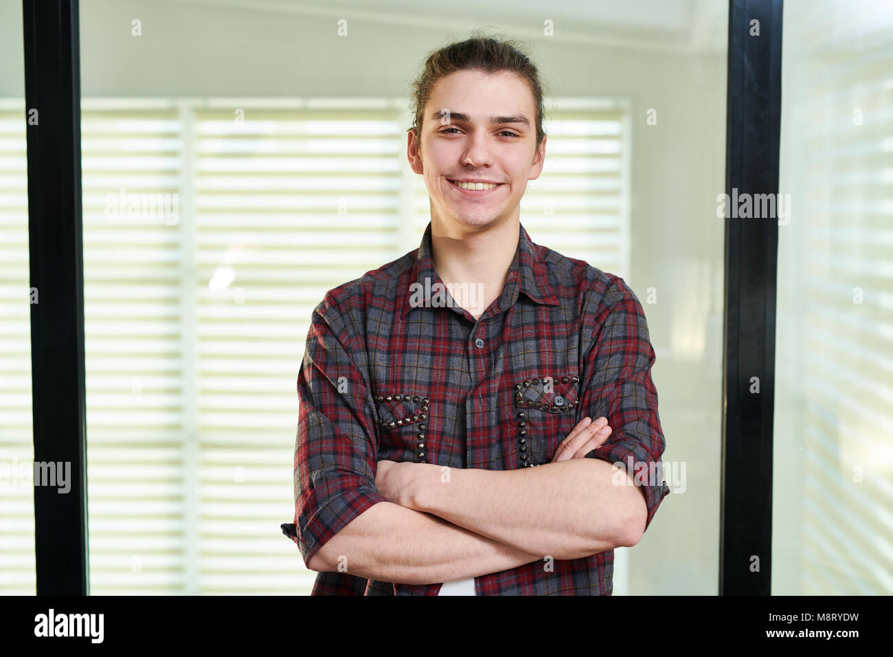 Cheerful software developer Stock Photo - Alamy