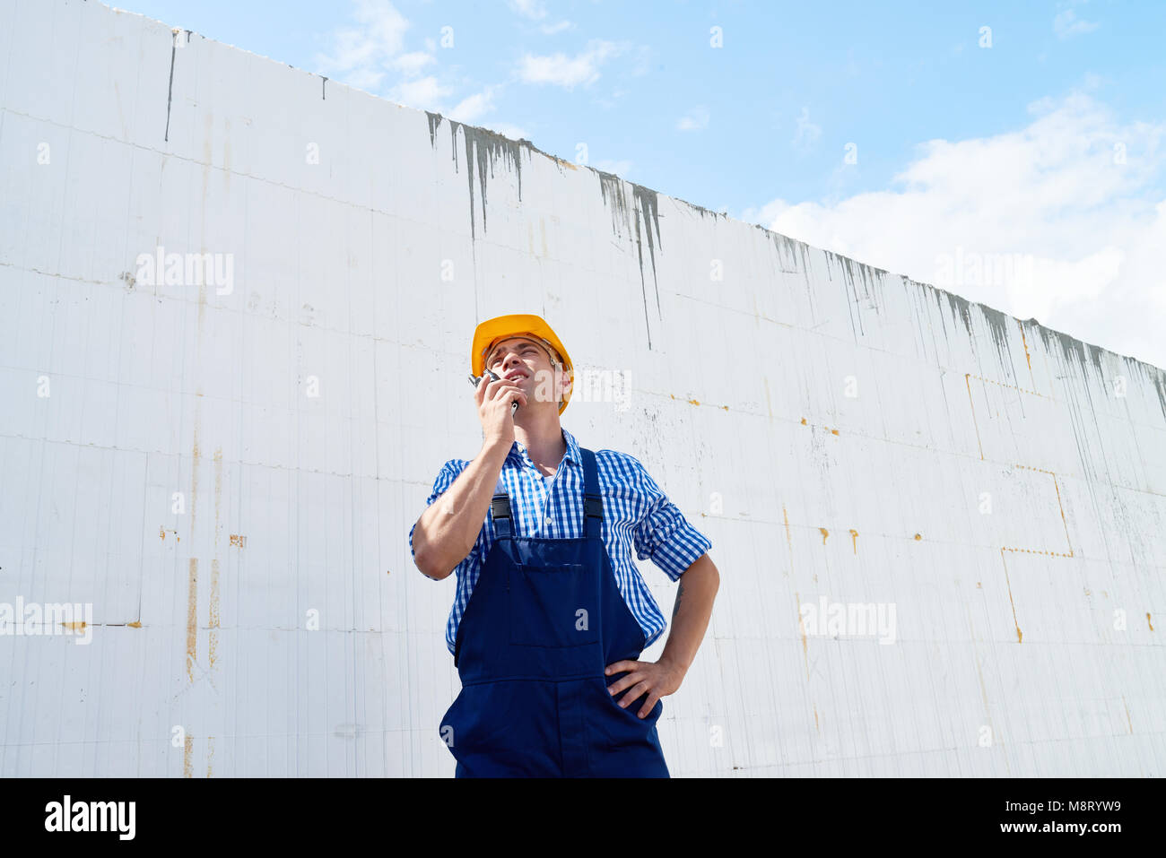 Construction Worker Using Portable Radio Stock Photo - Alamy