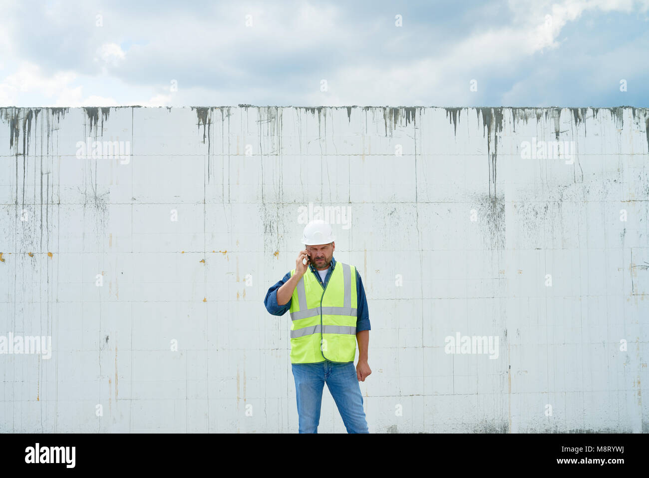 Construction Foreman Calling by Phone Stock Photo - Alamy