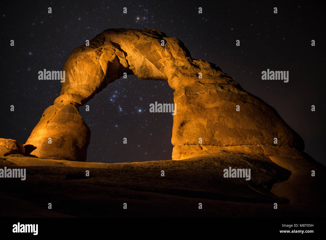The Orion constellation shines through Delicate Arch in Arches National ...