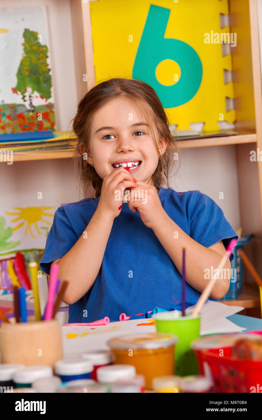 Small students girl painting in art school class Stock Photo - Alamy