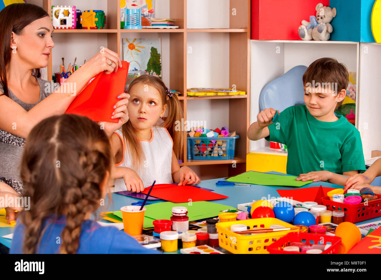 School children with scissors in kids hands cutting paper Stock Photo ...