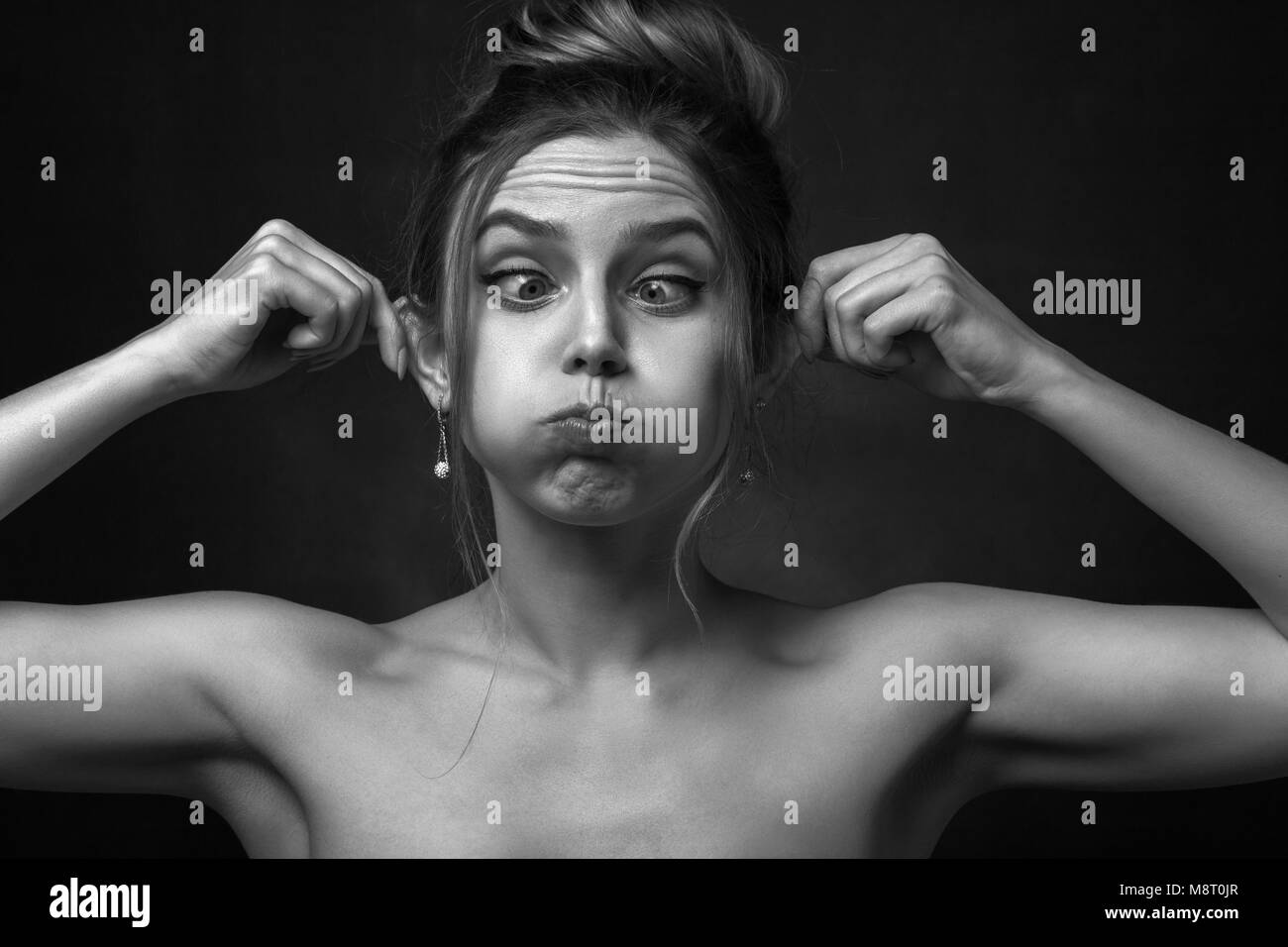 Woman blowing cheeks hi-res stock photography and images - Alamy