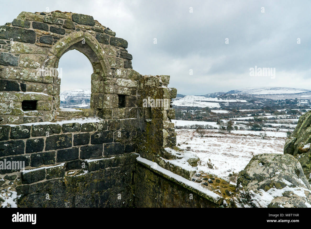 The ruins of an old monestry at Roche Rock in Cornwall with snow ...