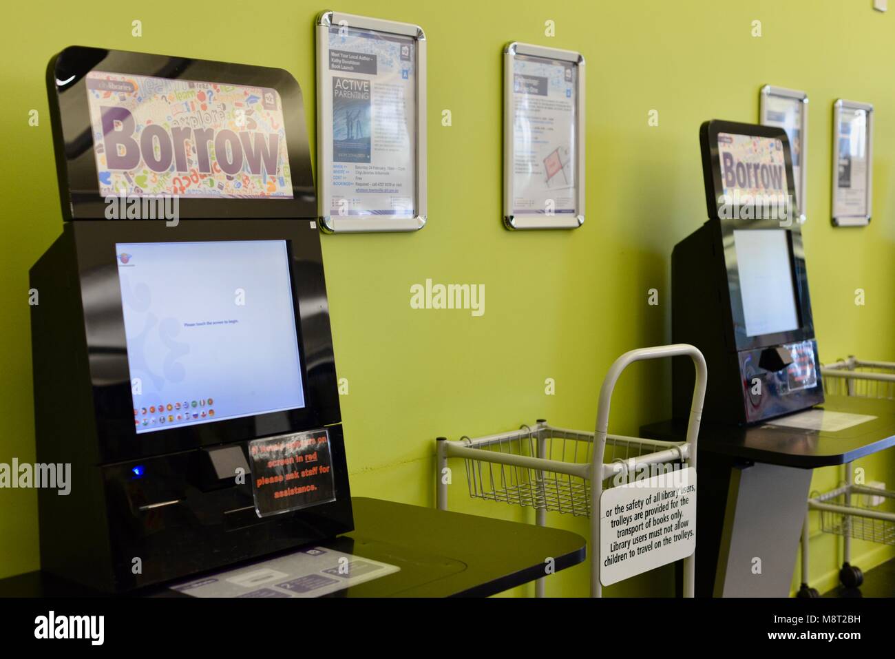 Borrow sign and borrowing booths at a library, CityLibraries Aitkenvale ...