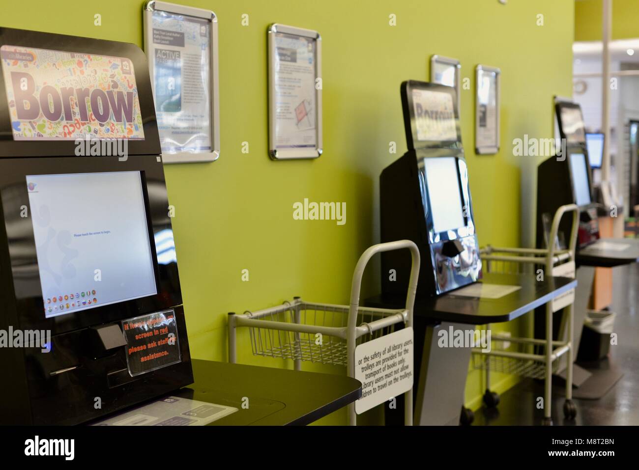 Borrow sign and borrowing booths at a library, CityLibraries Aitkenvale ...