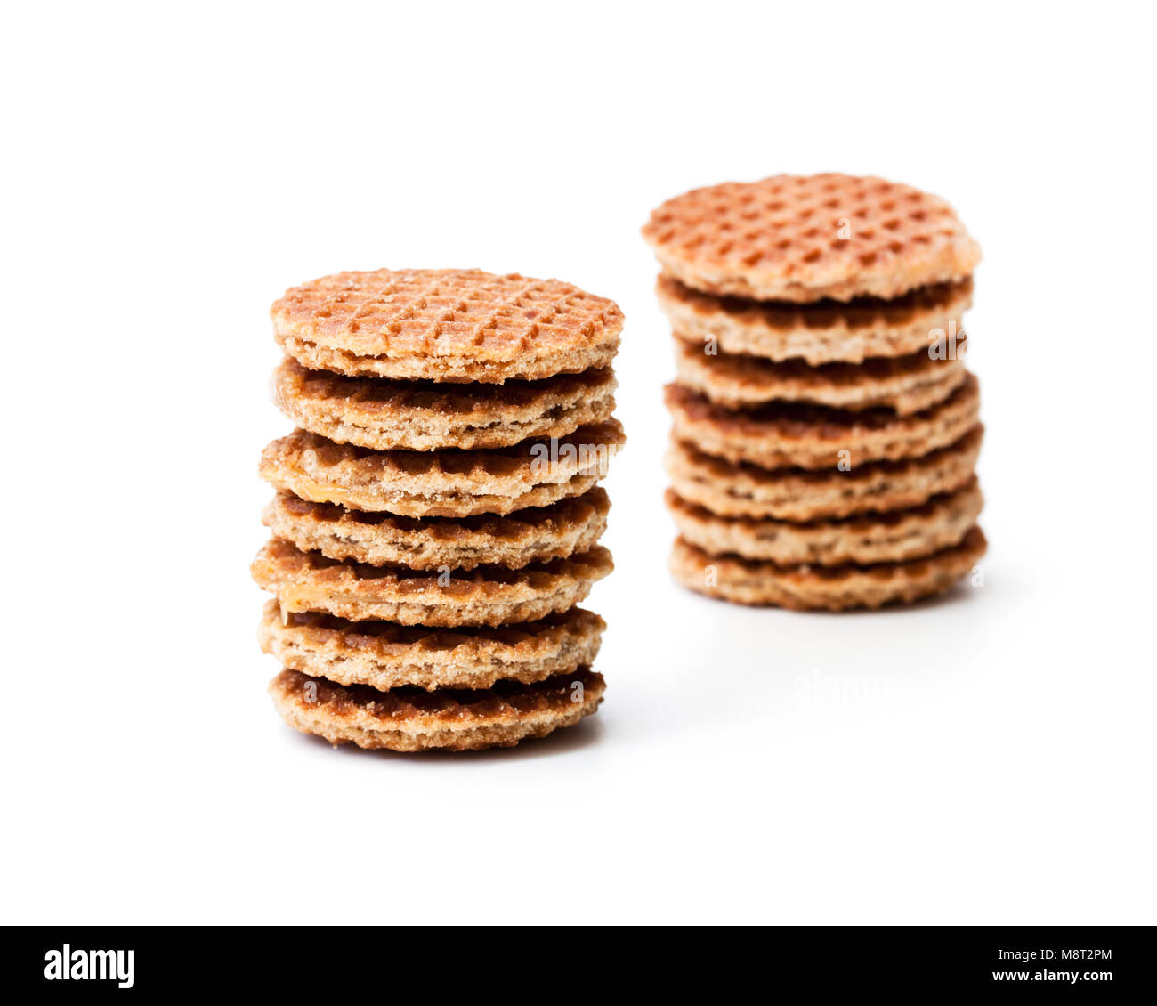 Stack of mini dutch caramel waffles isolated Stock Photo - Alamy