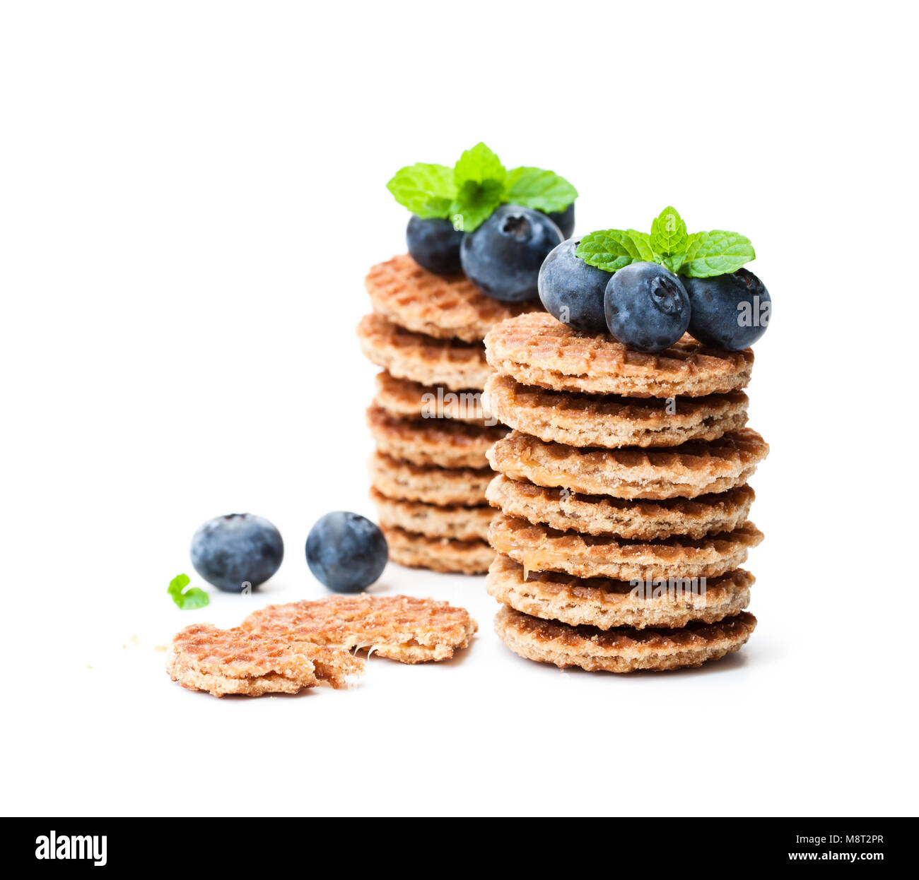 Stack of mini dutch caramel waffles with blueberry isolated on white ...
