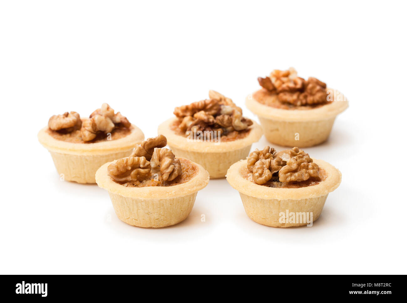 mini ginger and walnut tarts isolated on white Stock Photo - Alamy