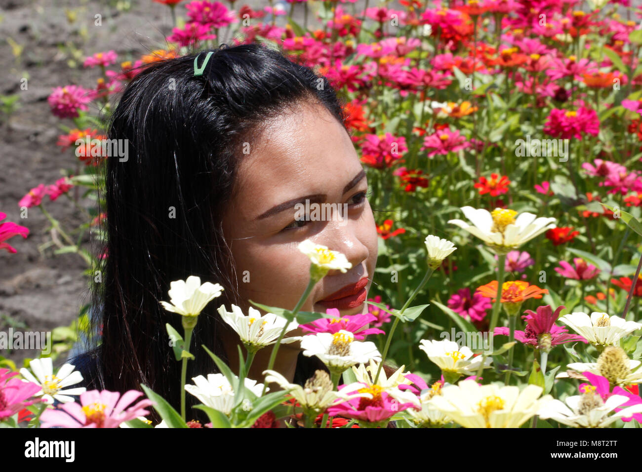 A girl enjoying around Refugia ( an area with several species of plants ...