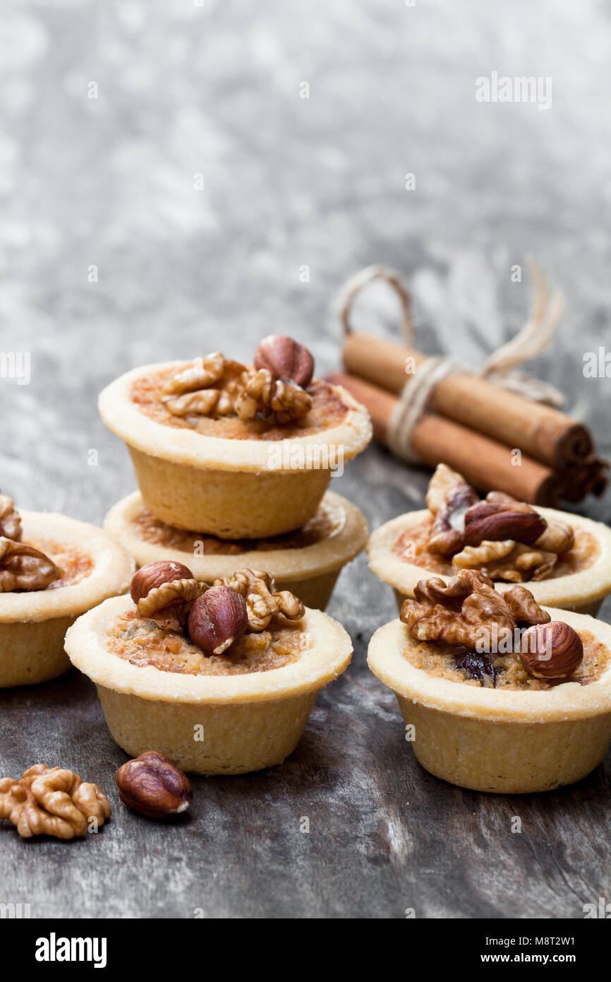 mini ginger and walnut tarts on wooden background Stock Photo - Alamy