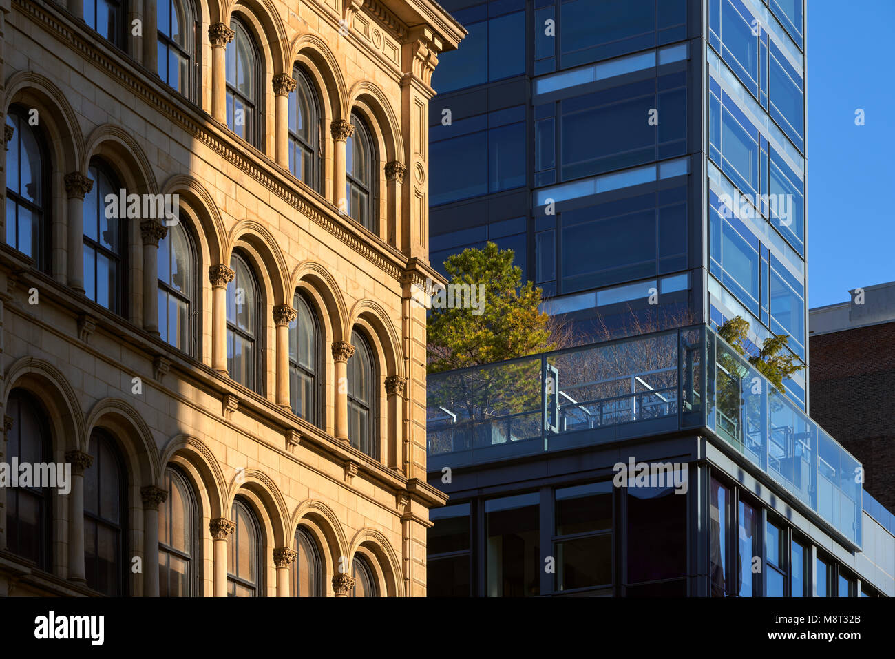 Soho building facades with contrasting architectural styles. New York ...