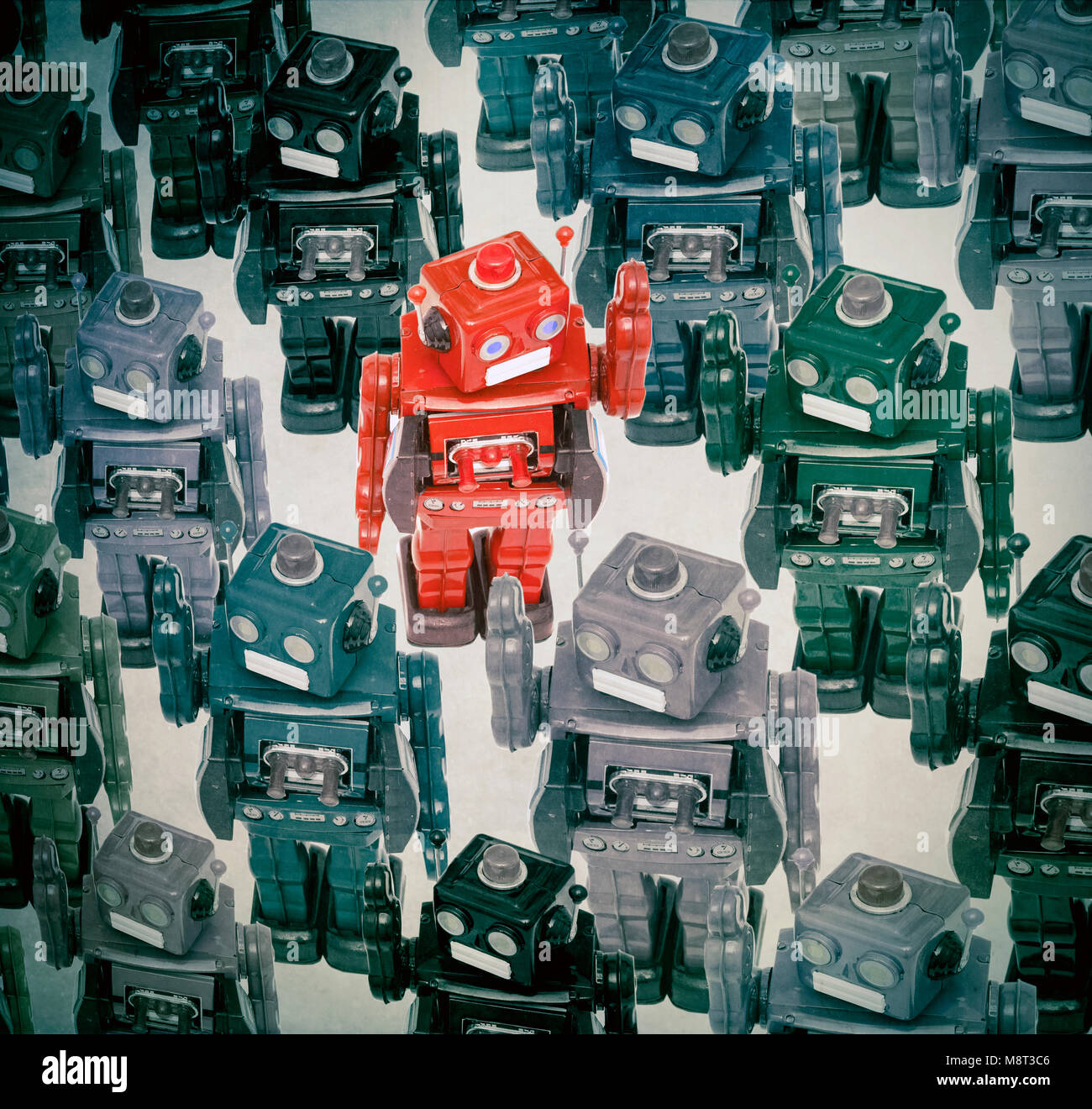 lots of robots in a crowd with on going the other direction Stock Photo ...