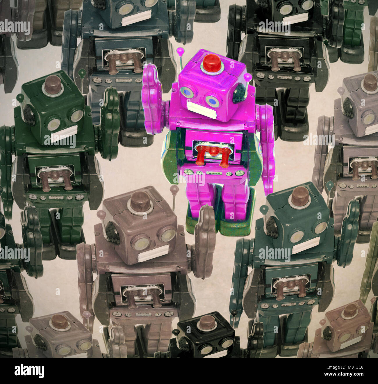 lots of robots in a crowd with one pink robot going the other direction ...