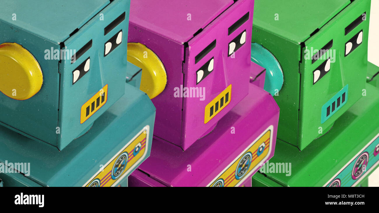 three robots colorful looking on macro image Stock Photo - Alamy