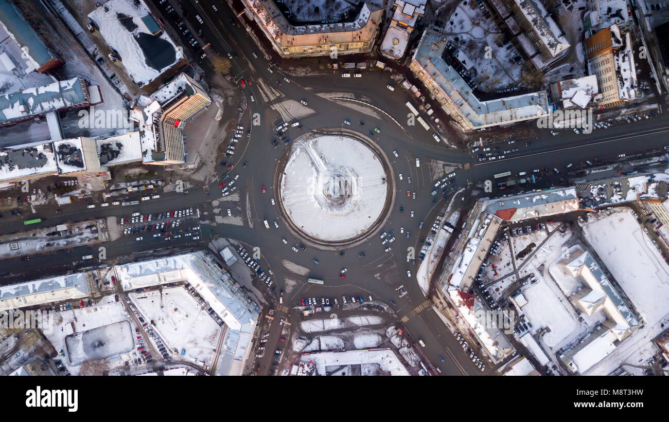 City square with car traffic view from above. City landscape with a ...