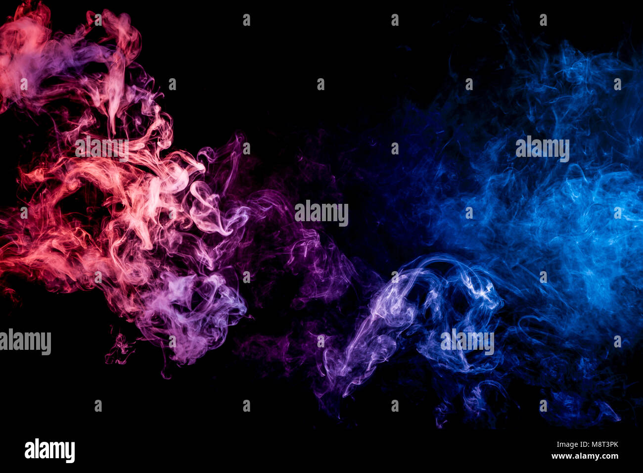 Pink and blue cloud of smoke of black isolated background. Background ...