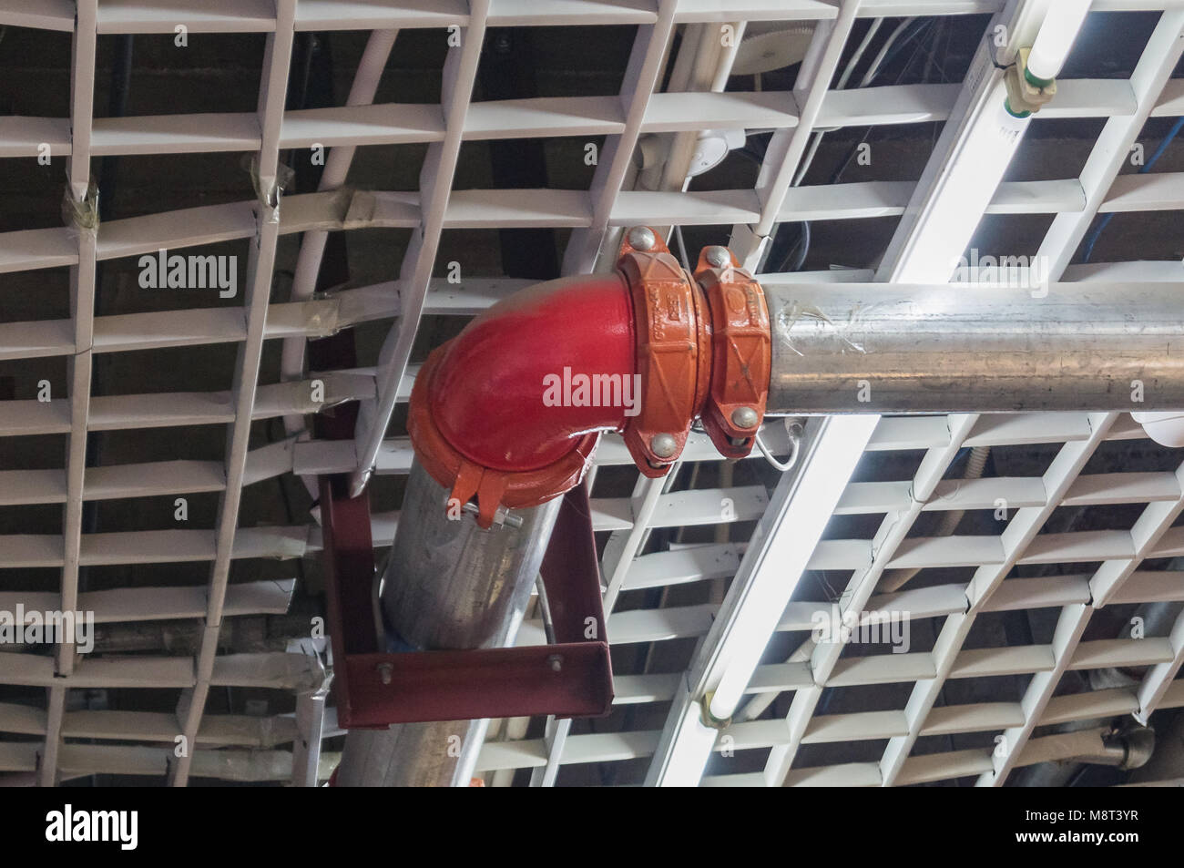 Fire extinguishing system in a public building under the ceiling. Red ...