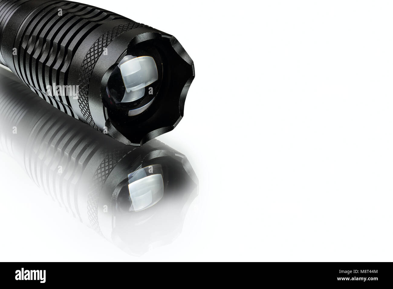 black anodized aluminium waterproof tactical flashlight on black ...