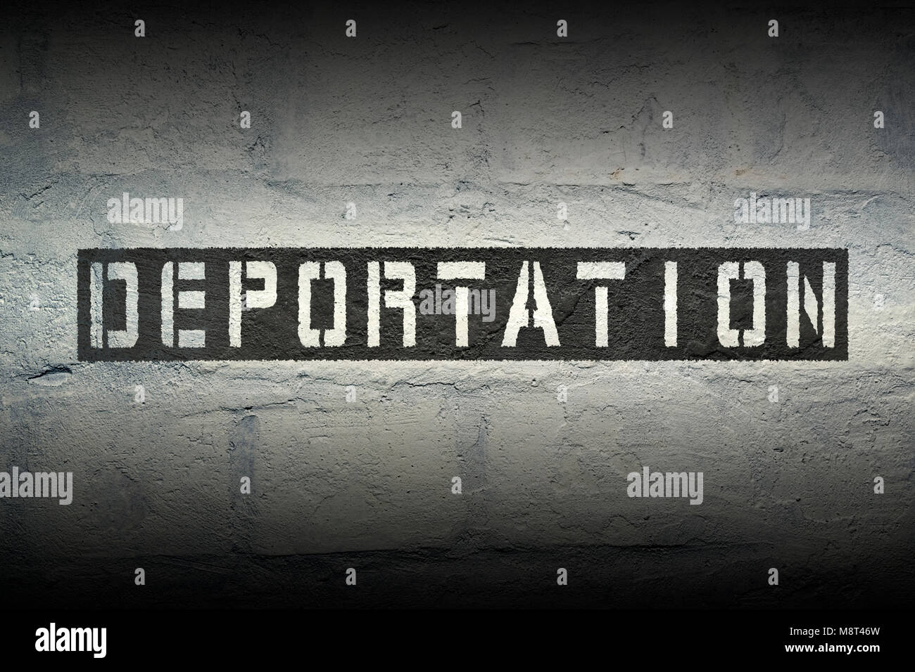 deportation stencil print on the grunge white brick wall Stock Photo ...