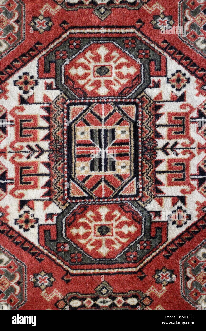 geometric pattern old Persian carpet closeup Stock Photo - Alamy