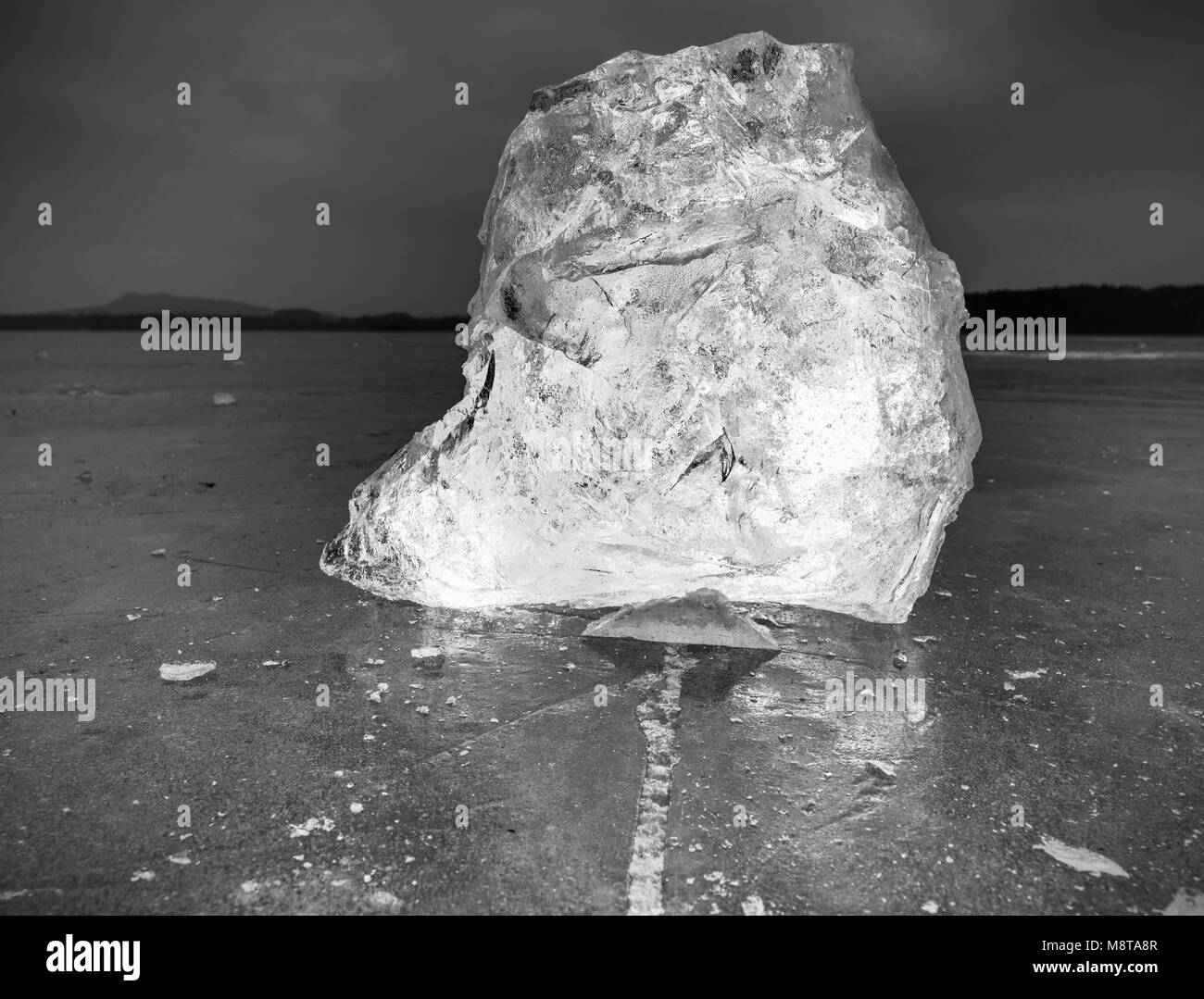 Ice with reflection on the lake. Crushed ice floe on reflective natural ...