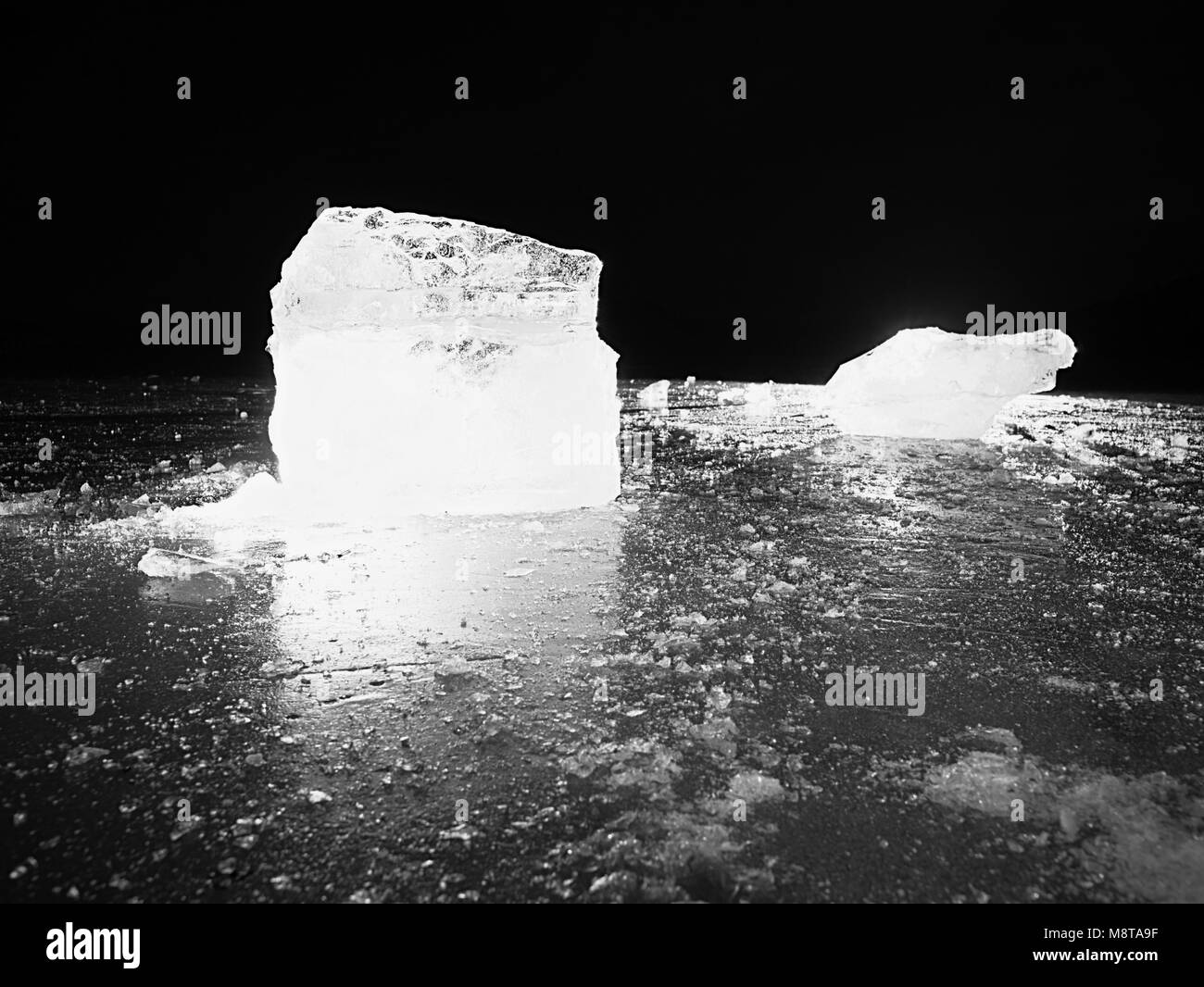 Shining wrinkled surface broken ice, fresh icy pieces on flat frost ...