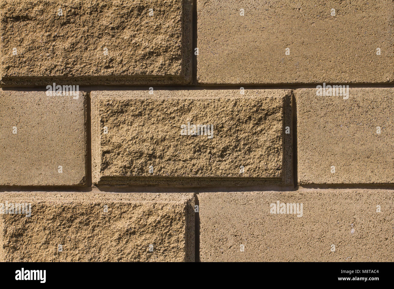 Stone wall of the rectangular bricks - close up Stock Photo - Alamy