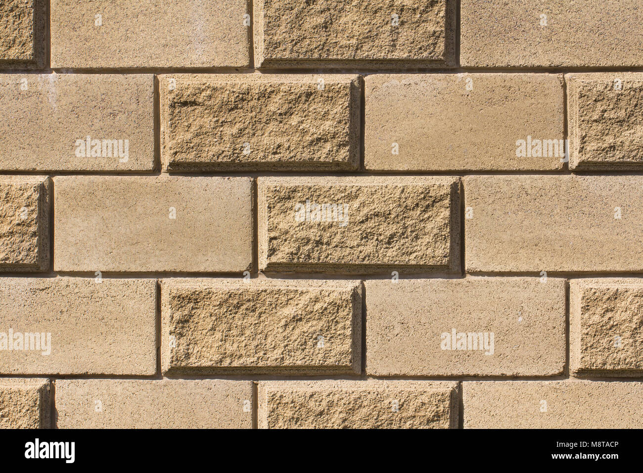 Stone wall of the rectangular bricks - close up Stock Photo - Alamy
