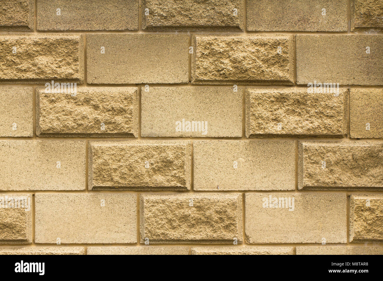 Stone wall of the rectangular bricks - close up Stock Photo - Alamy
