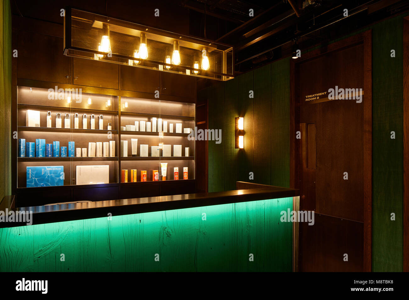 Illuminated display shelf and counter in spa area. KXU London, London ...