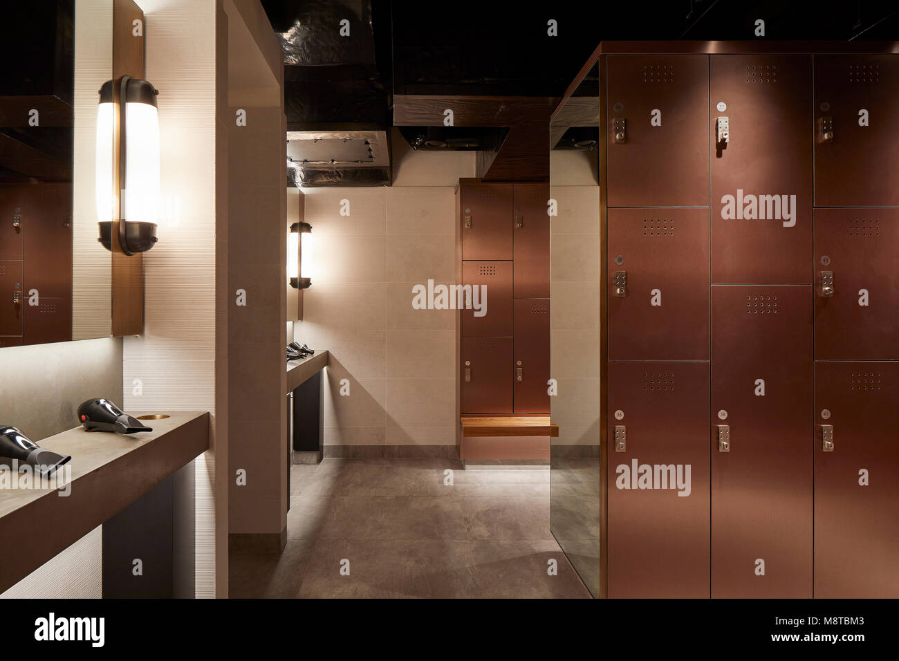 Changing room with lockers and styling area. KXU London, London, United ...
